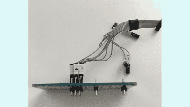A MKR Proto Shield and 6 2.54mm straight male headers used to access ...